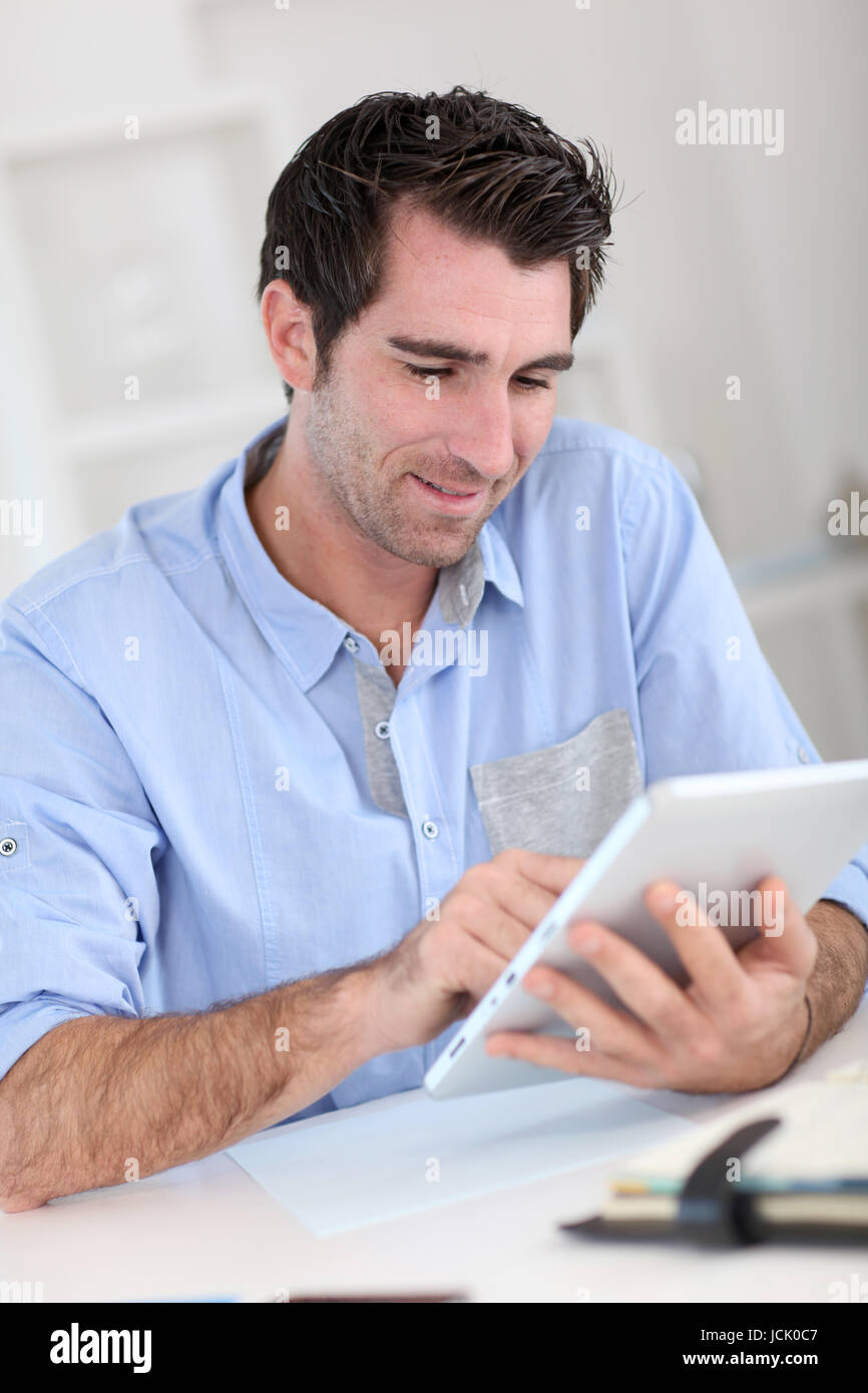 Office worker using electronic tablet Stock Photo - Alamy