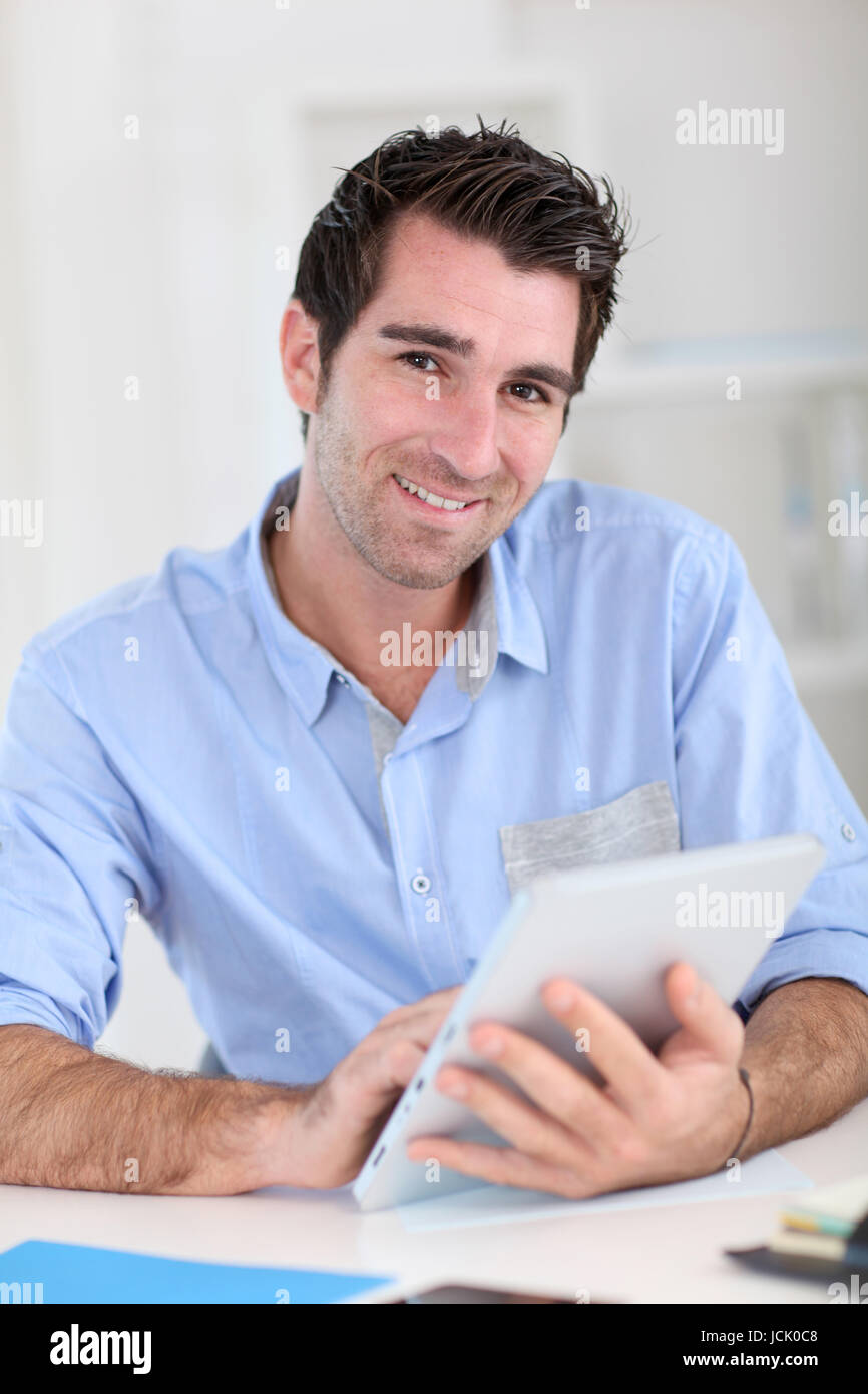 Office worker using electronic tablet Stock Photo - Alamy