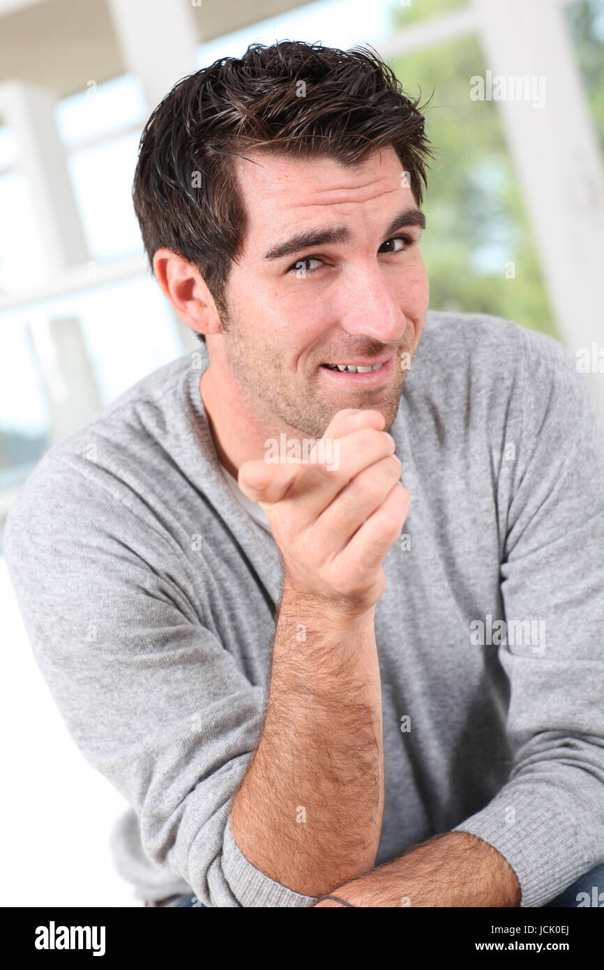 Portrait of man pointing at camera Stock Photo - Alamy