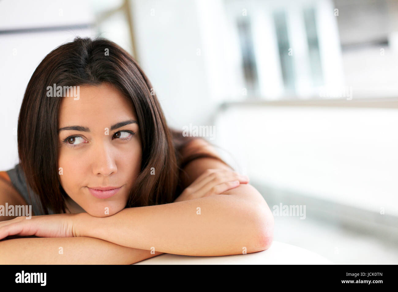 Portrait of brunette with bored look Stock Photo - Alamy