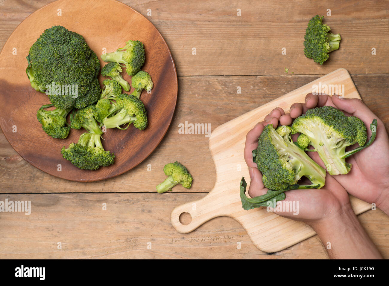 Top view of Chef hand cutting broccoli for cooking Stock Photo - Alamy