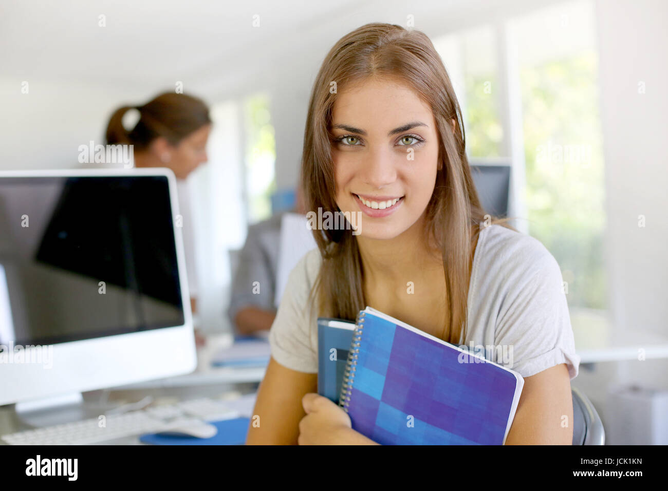 Portrait of smiling student girl in class Stock Photo - Alamy