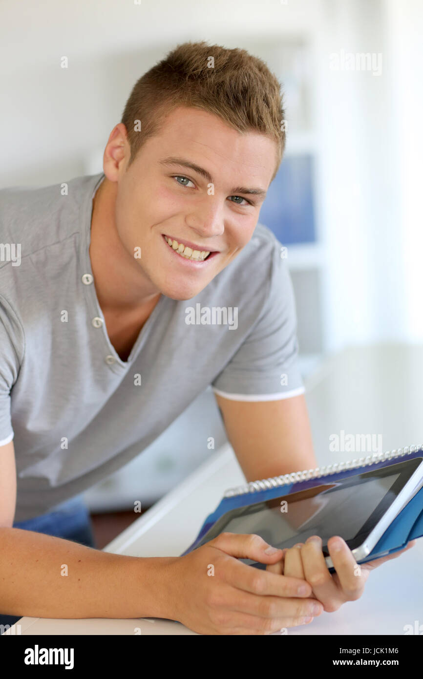 Portrait of student using electronic tablet Stock Photo - Alamy