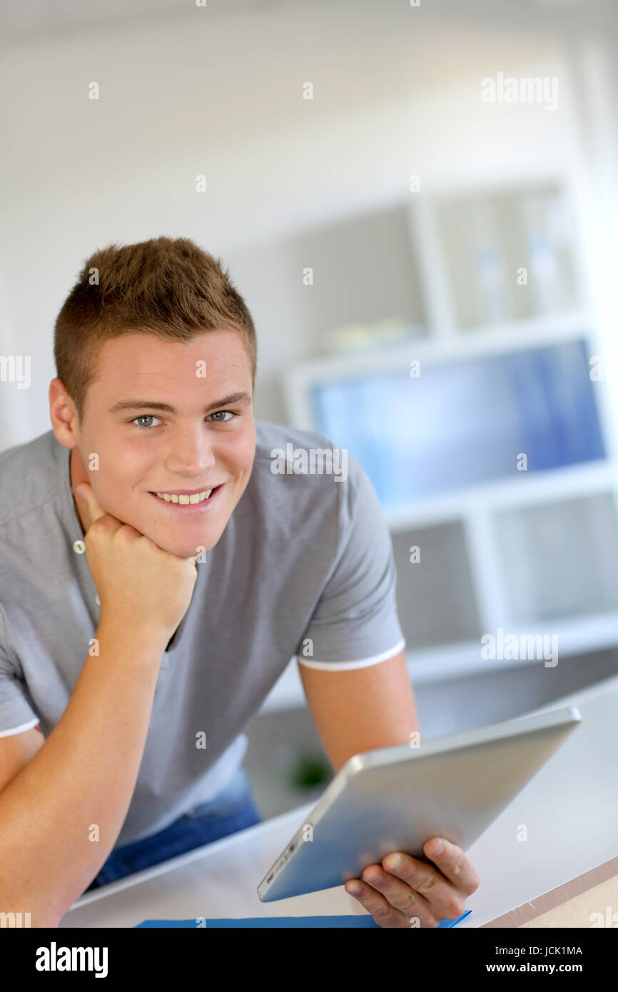 Portrait of student using electronic tablet Stock Photo - Alamy