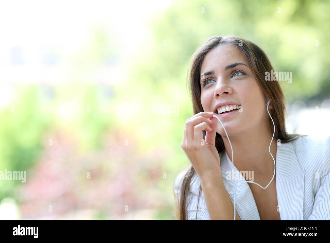 Beautiful girl talking with smartphone handsfree device Stock Photo - Alamy