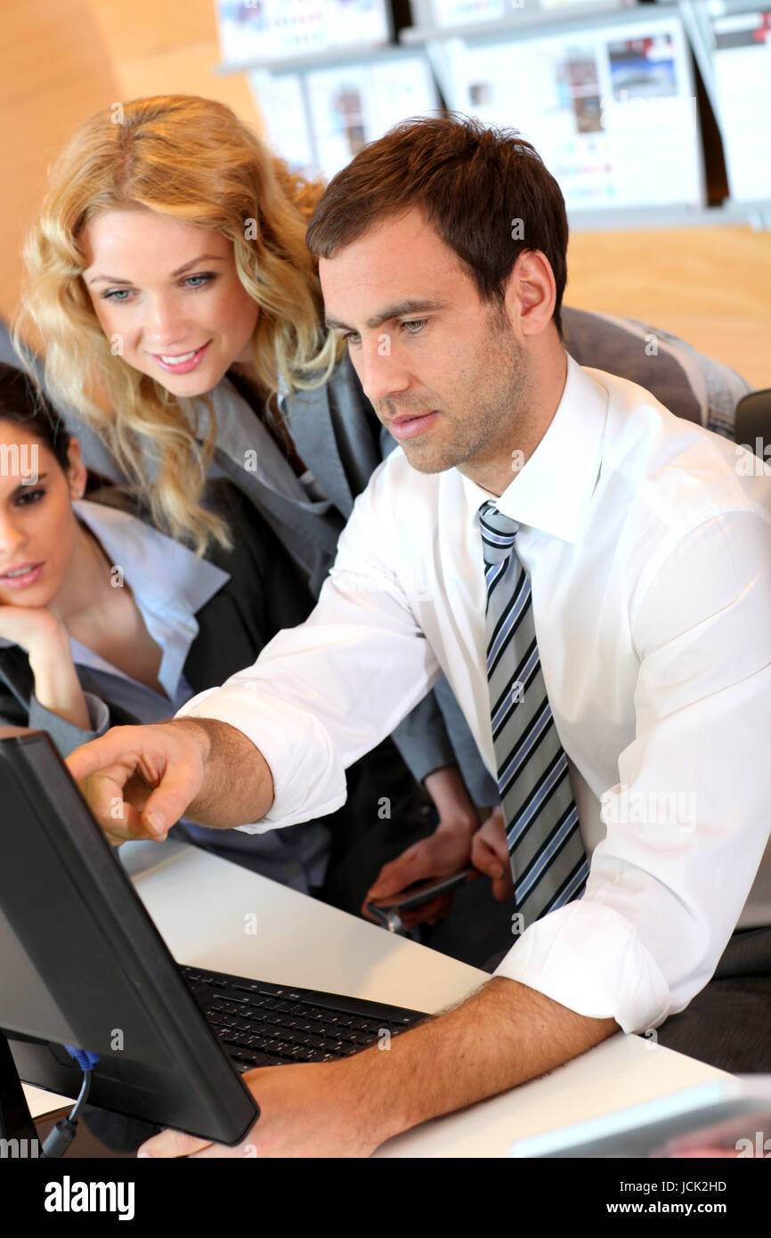 Business meeting in front of desktop computer Stock Photo - Alamy