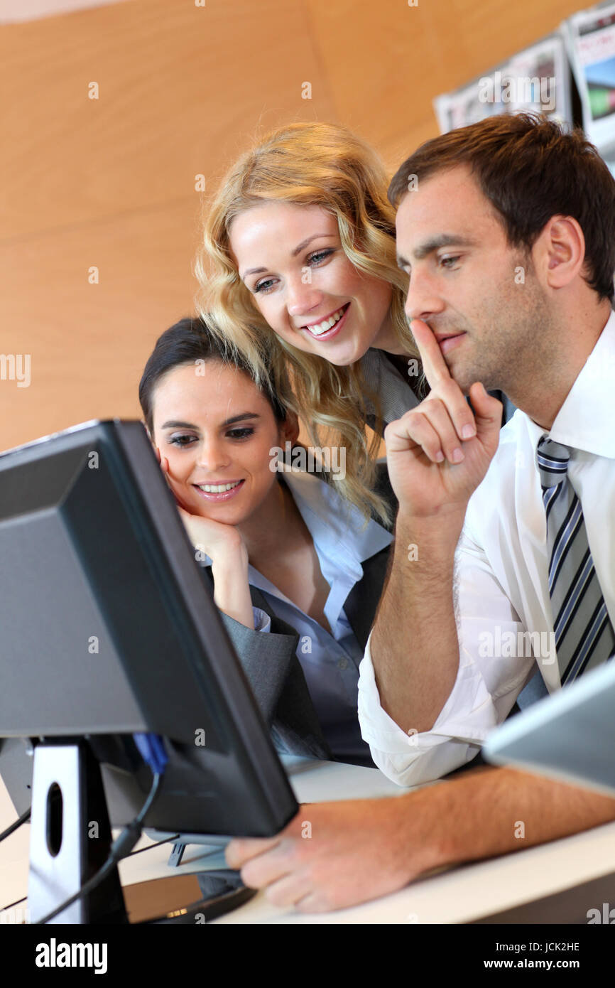 Business meeting in front of desktop computer Stock Photo - Alamy