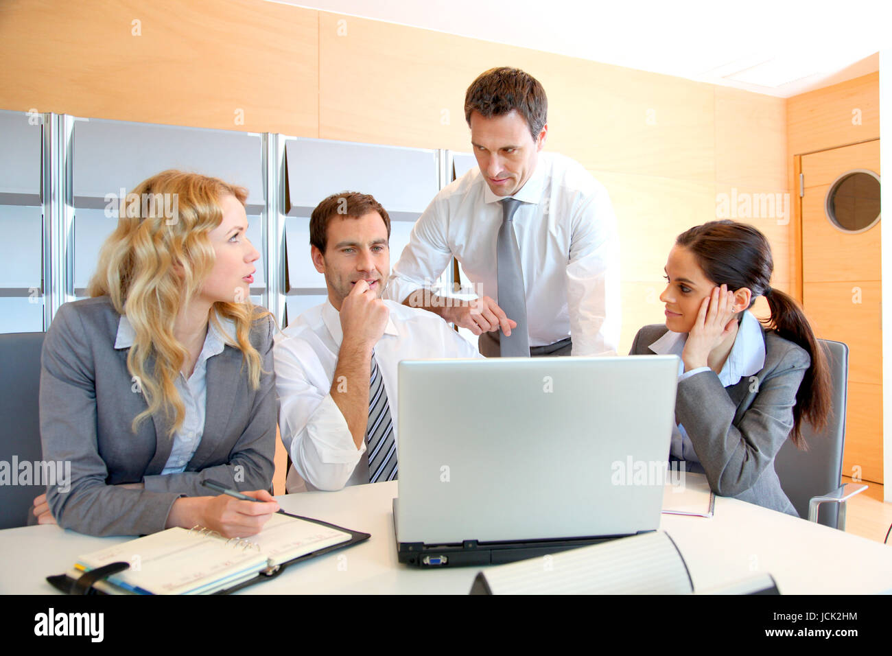 Business meeting in office with laptop computer Stock Photo - Alamy