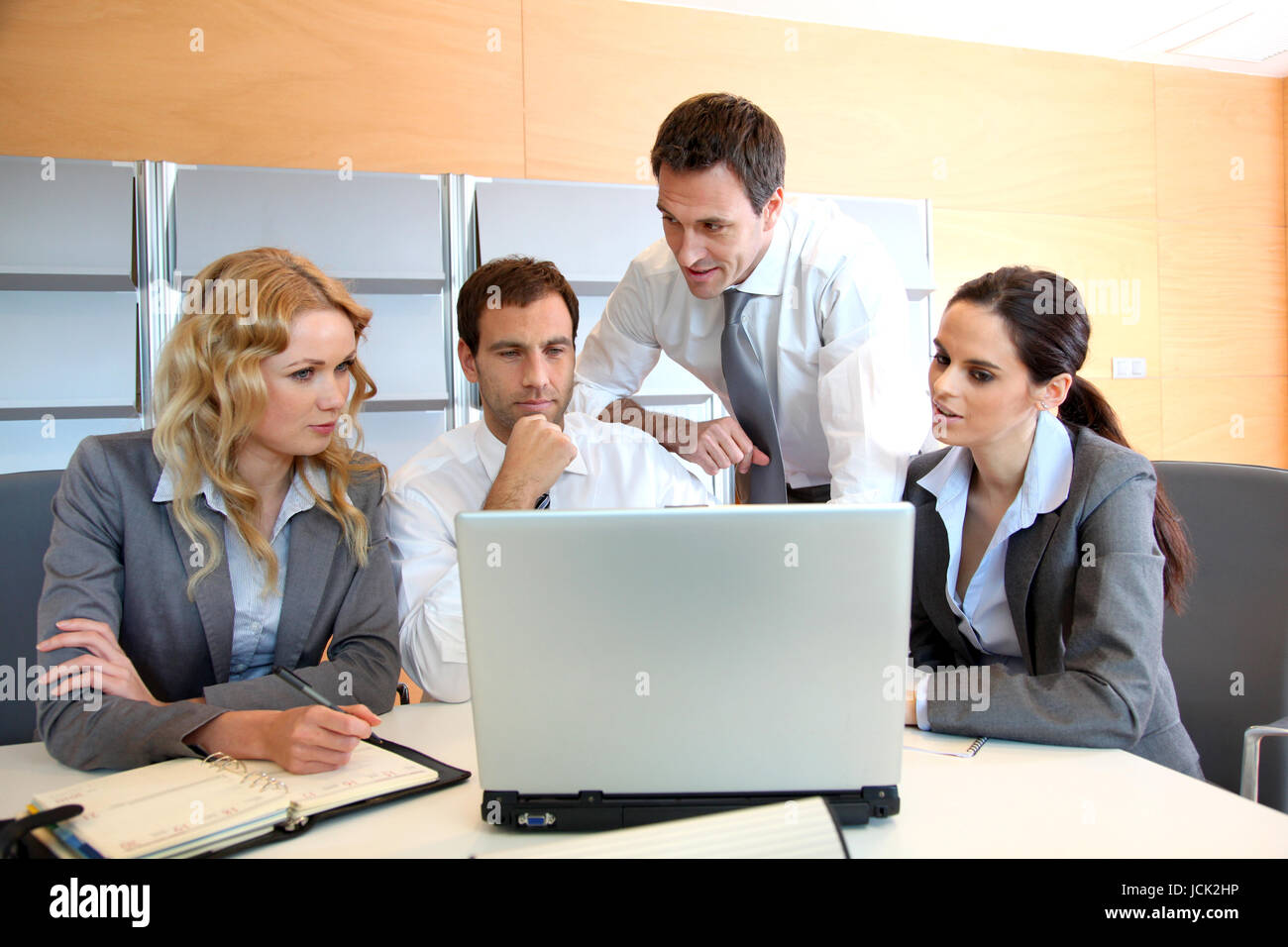 Business meeting in office with laptop computer Stock Photo - Alamy