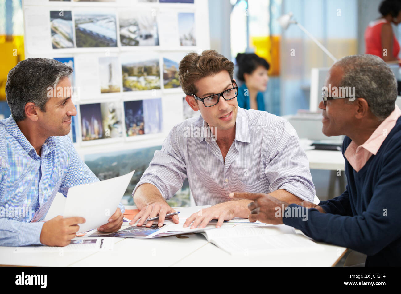 Group Of Men Meeting In Creative Office Stock Photo - Alamy