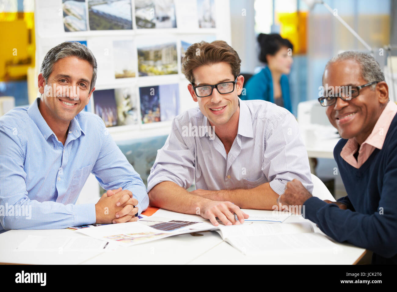 Group Of Men Meeting In Creative Office Stock Photo - Alamy