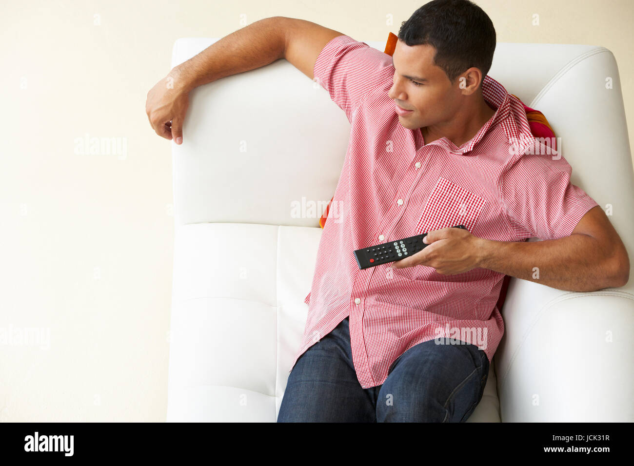 Overhead View Of Man Relaxing On Sofa Watching Television Stock Photo ...