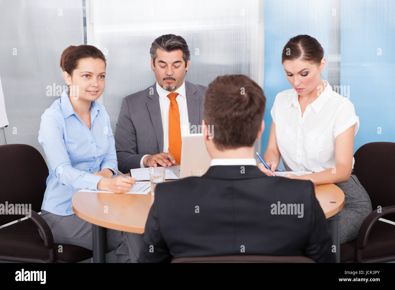 Businesspeople Conducting Interview Of A Candidate In The Office Stock ...