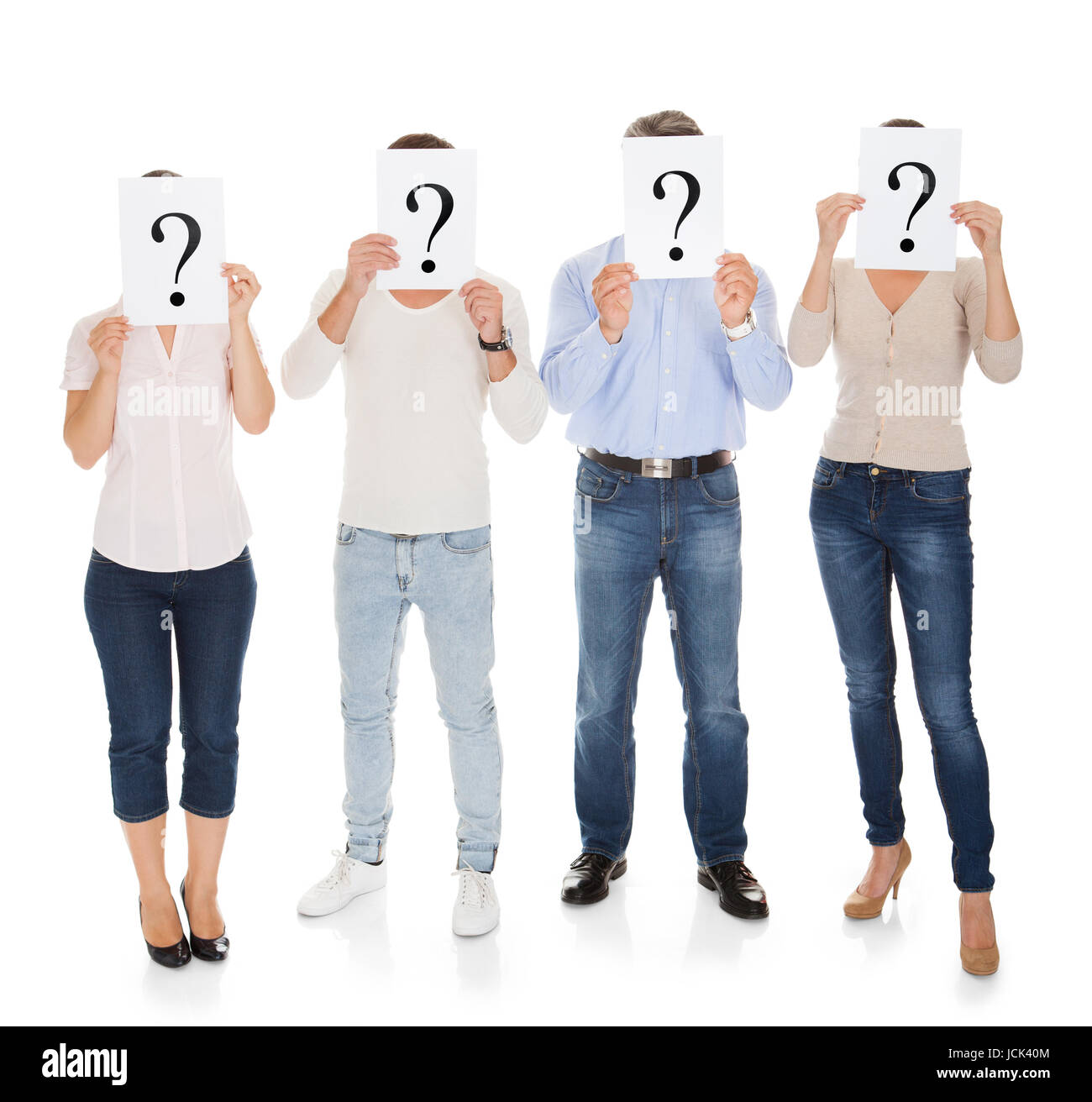 Group Of A People Holding Question Mark Sign In Front Of Their Face ...
