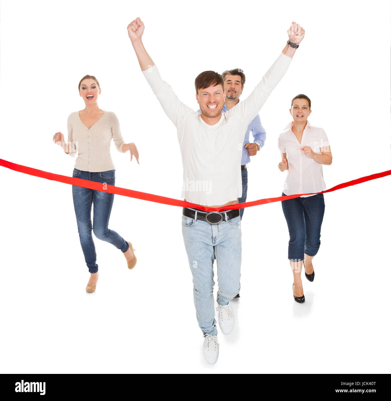 Portrait Of A Joyful Man With Hand Raised Crossing The Winning Line ...