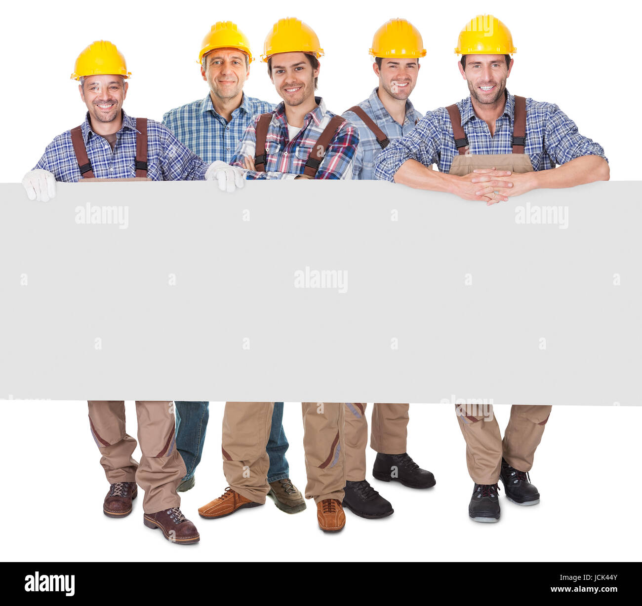 Group of construction workers presenting empty banner. Isolated on white Stock Photo - Alamy