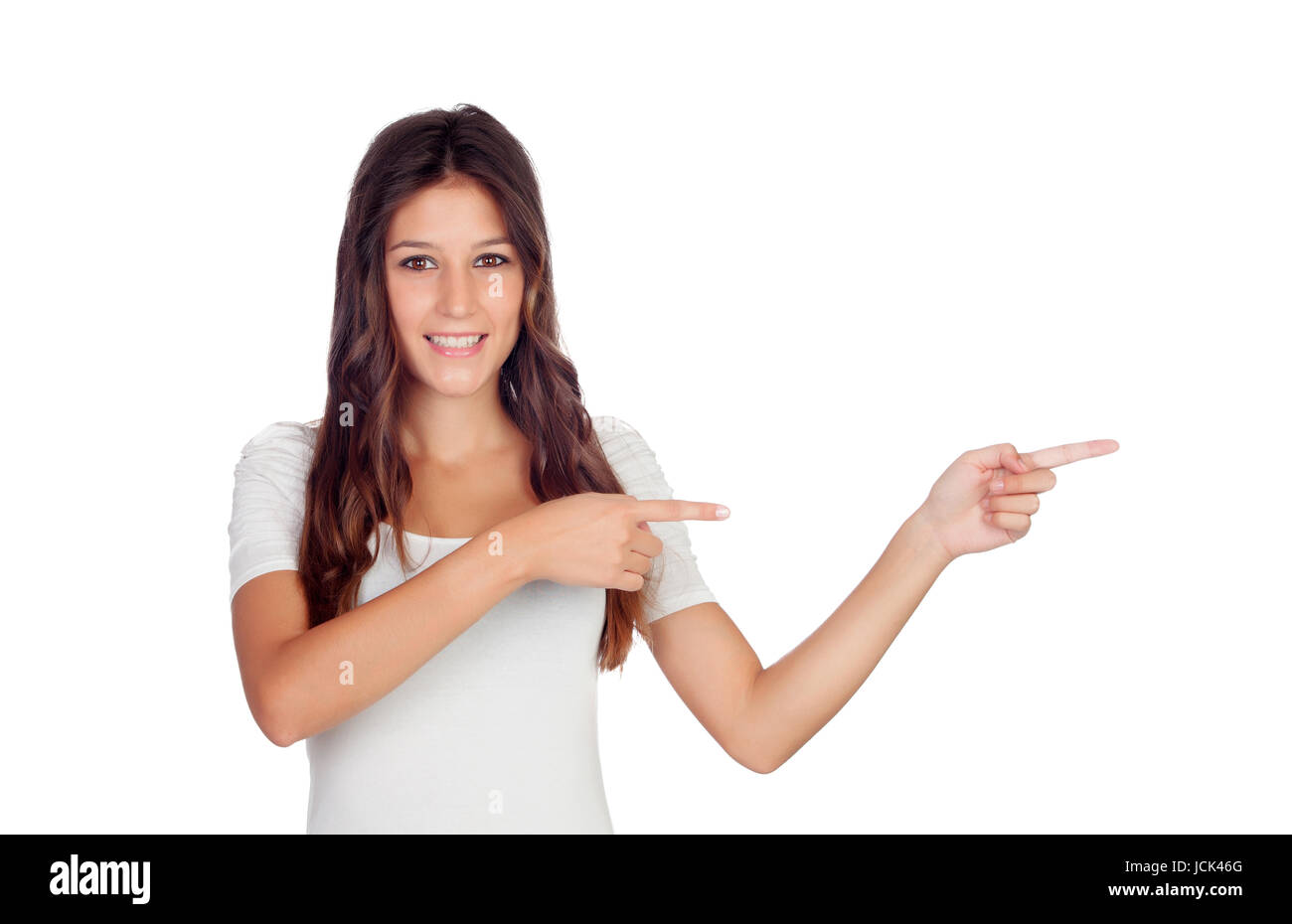 Attractive casual girl pointing at side something isolated on white ...