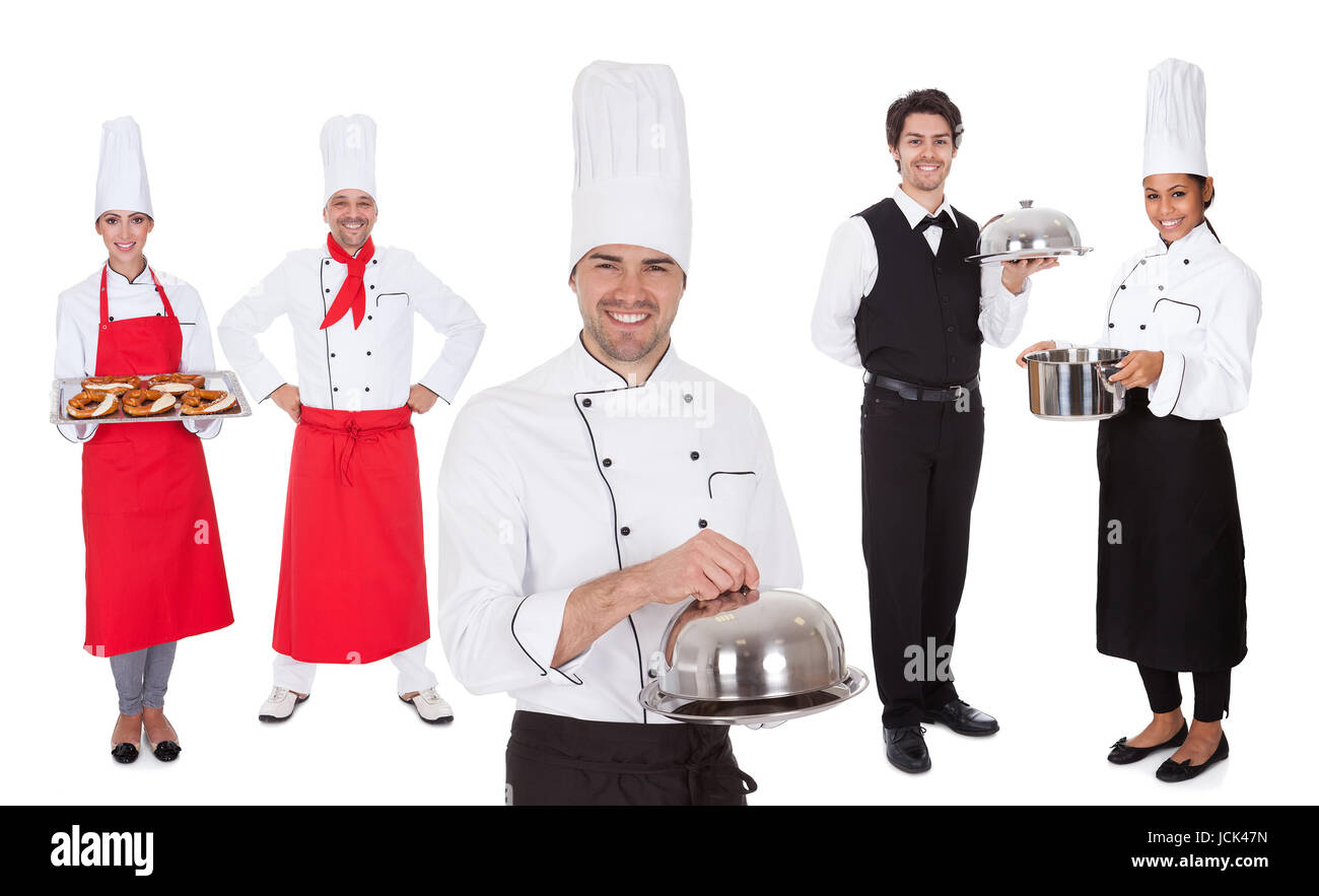 Chief-cooker and his team. Isolated on white Stock Photo - Alamy