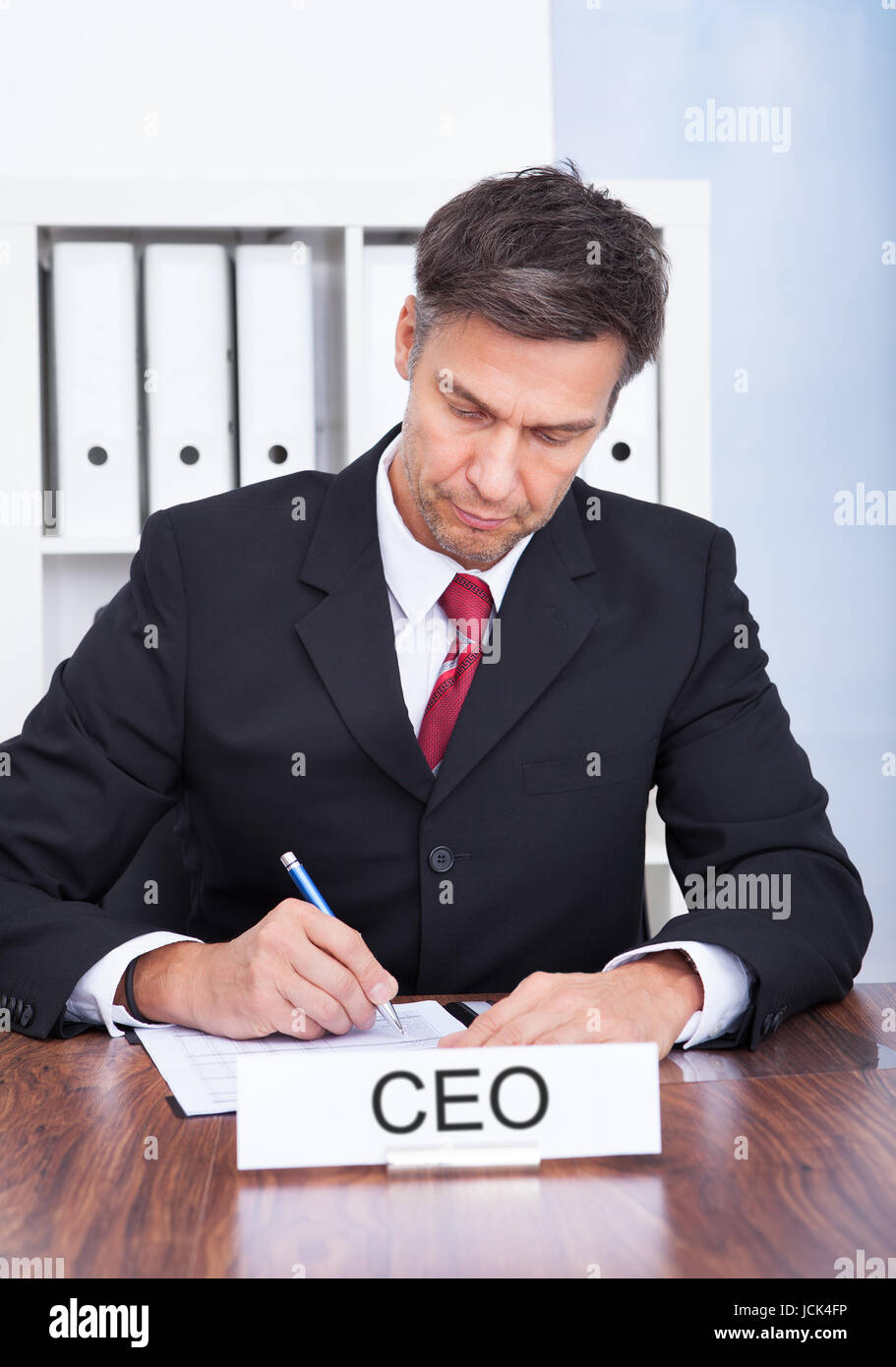 Mature Male Chief Executive Officer Working At Office Stock Photo - Alamy