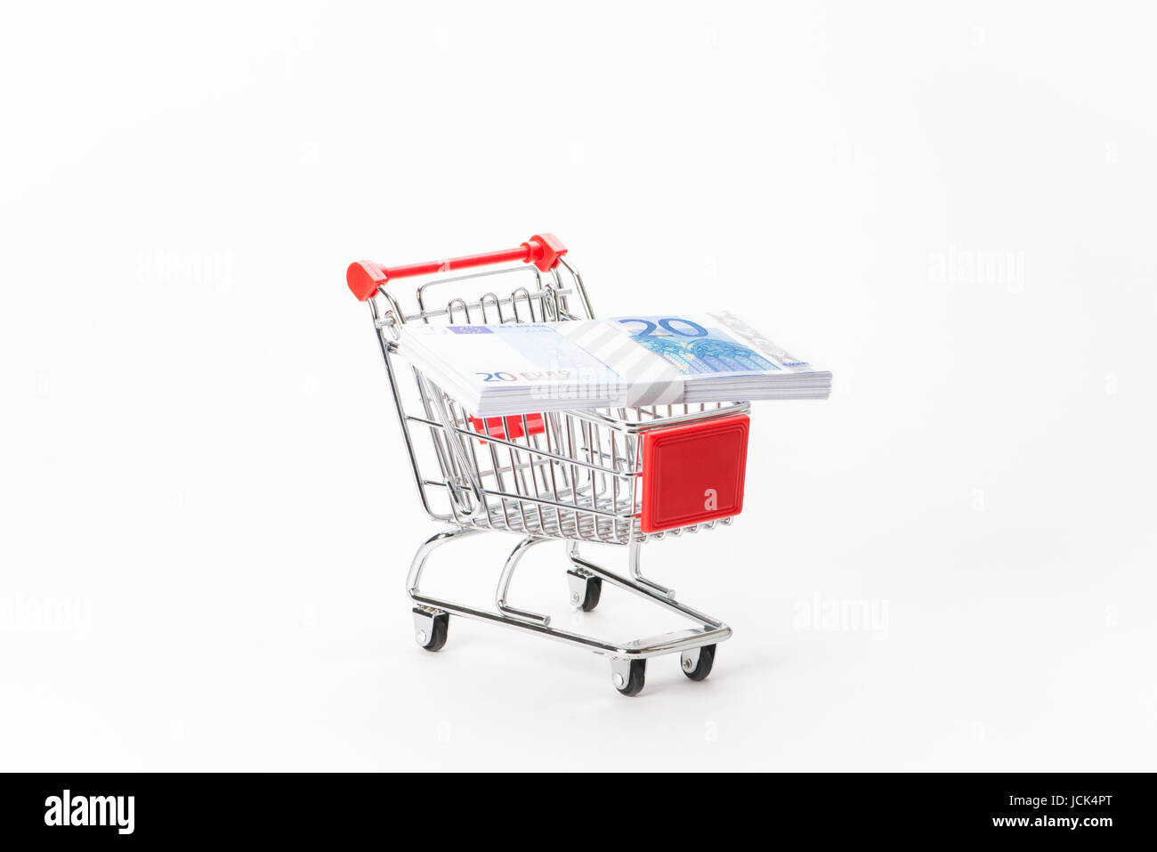 Caddy for shopping with money stack on white background Stock Photo - Alamy