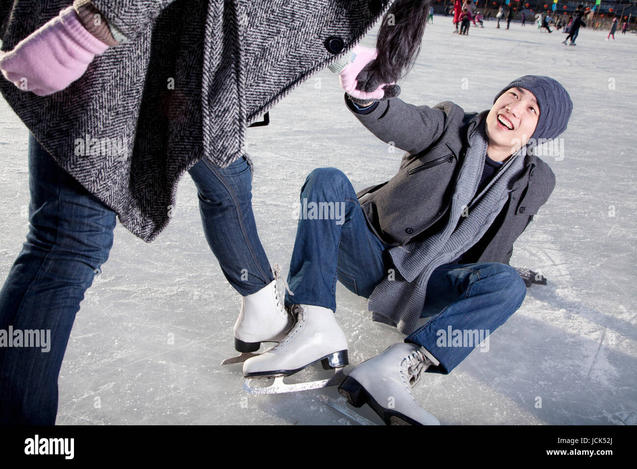 Couple falling ice skating hi-res stock photography and images - Alamy