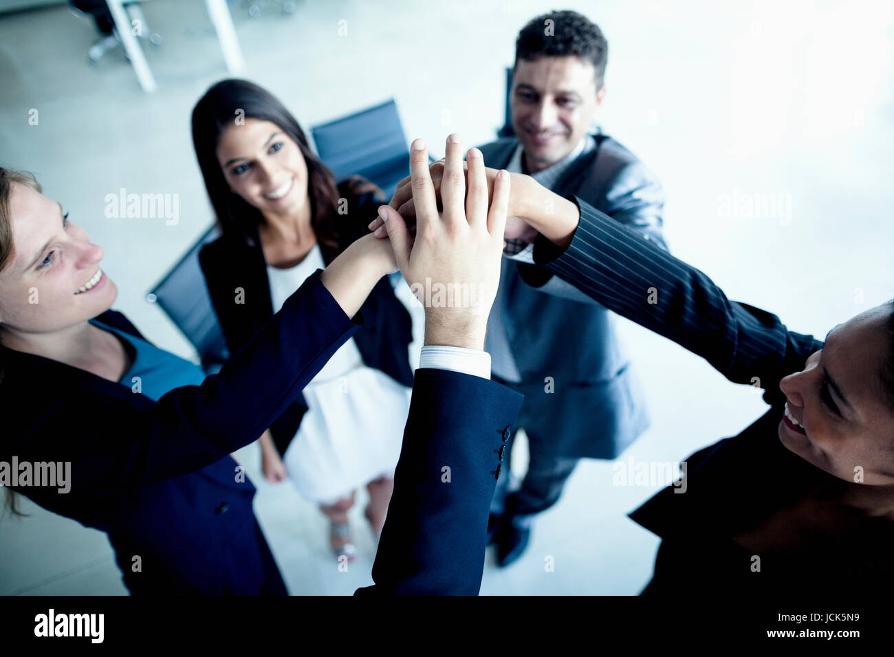 Standing smiling hands raised holding communication hi-res stock ...