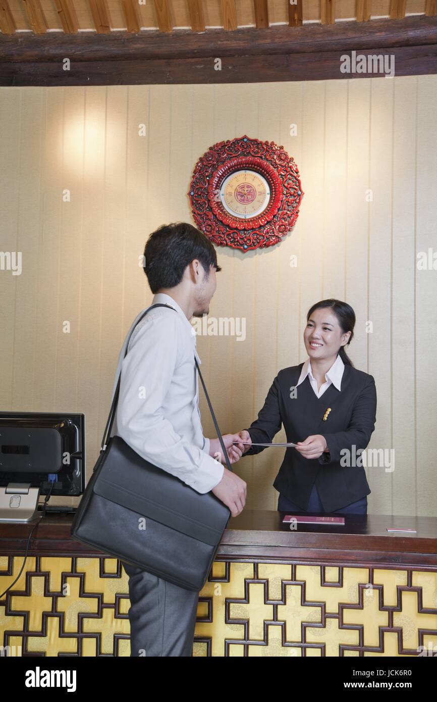 Chinese hotel receptionist hi-res stock photography and images - Alamy