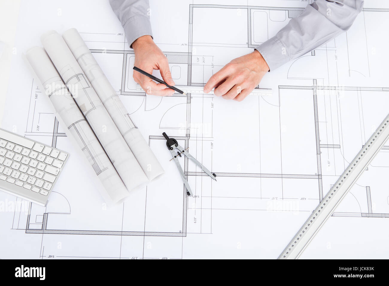 Close-up Of Person's Hand Drawing Plan On Blue Print Stock Photo - Alamy