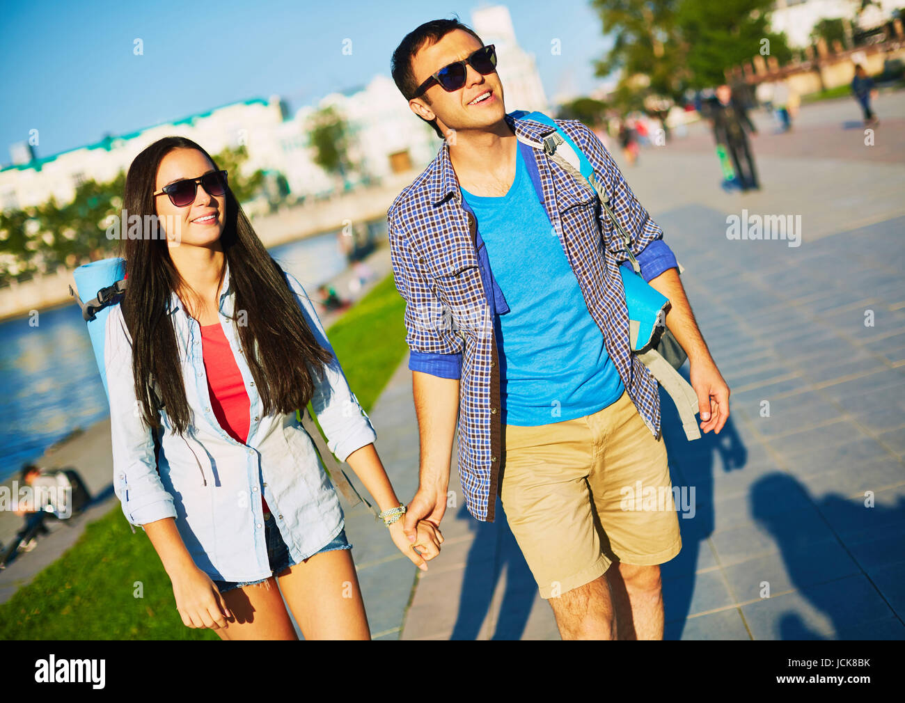 Amorous dates with backpacks sightseeing in a city Stock Photo - Alamy