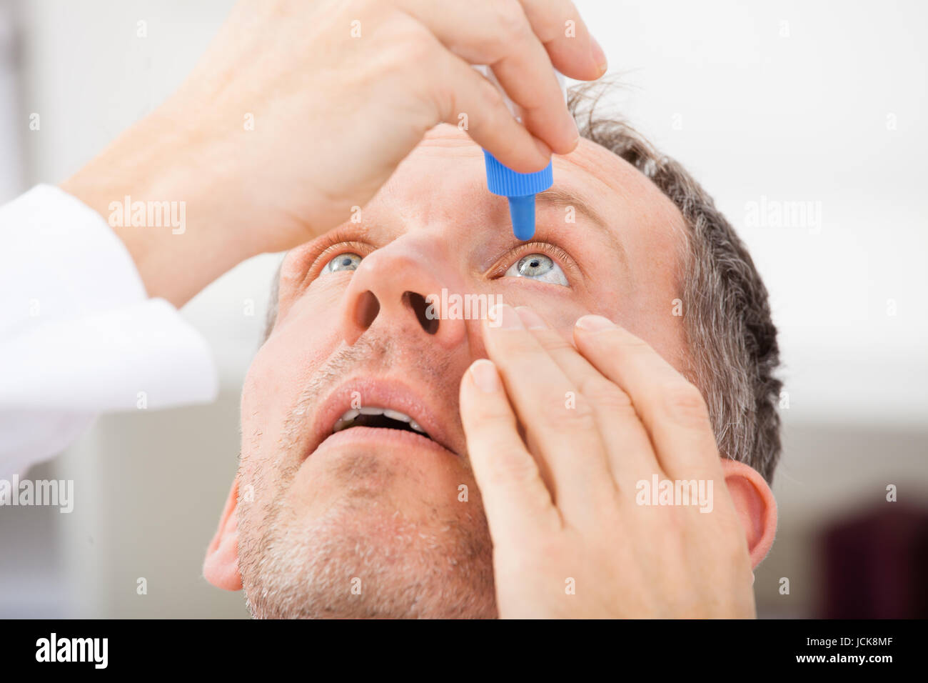 Close-up Of A Mature Man Putting Eye Drops In Eyes Stock Photo - Alamy