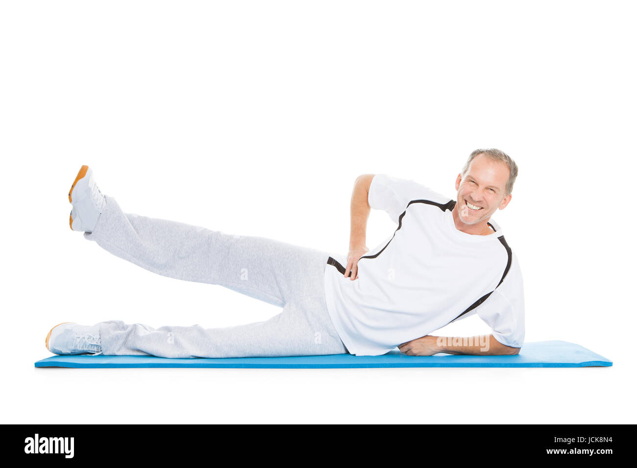 Gym exercise man lying Cut Out Stock Images & Pictures - Alamy