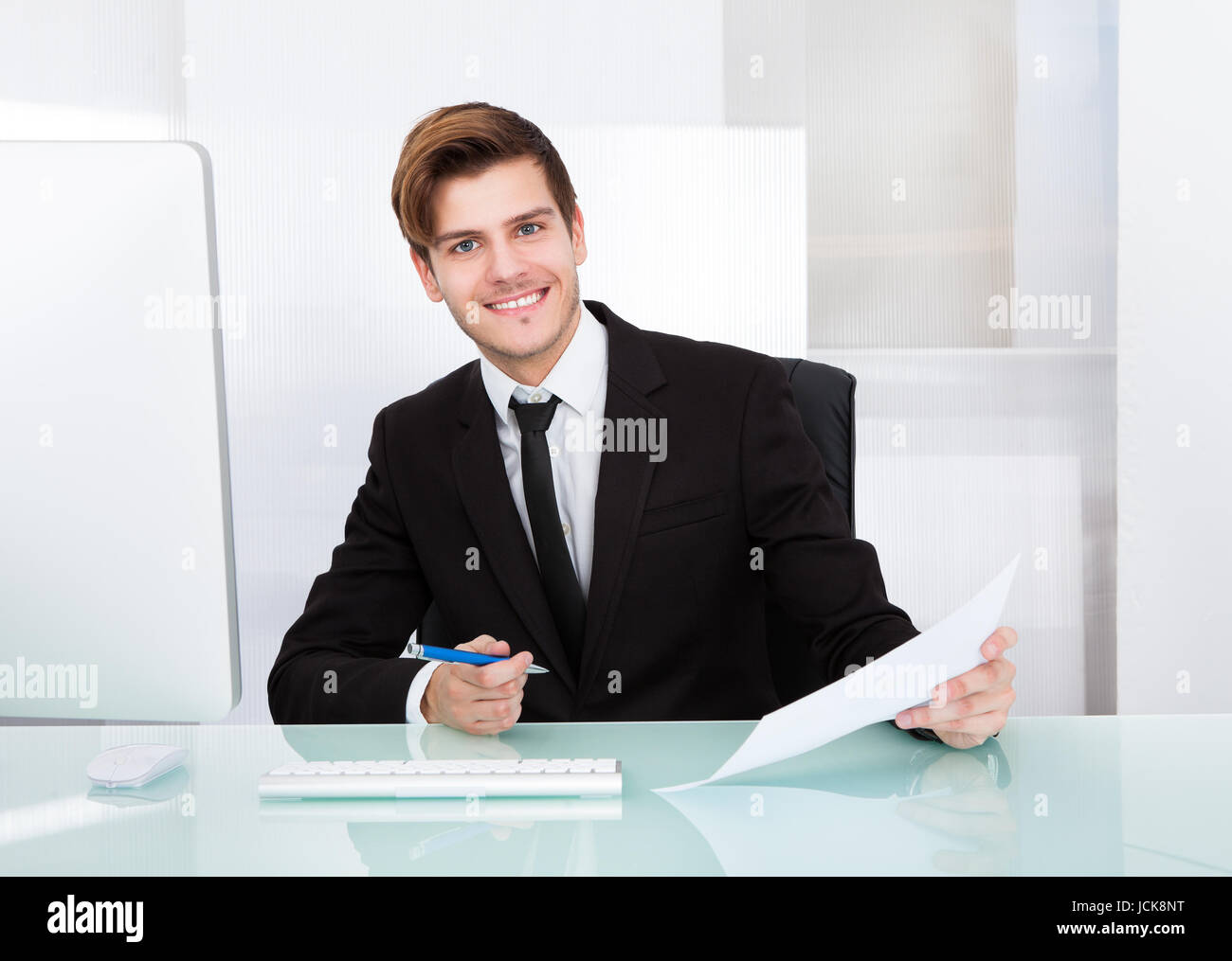Portrait Of Happy Young Businessman With Documents Stock Photo - Alamy
