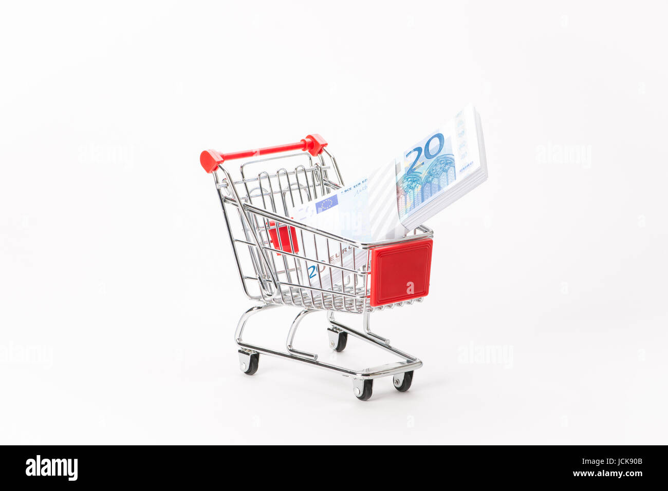 Caddy for shopping with money stack on white background Stock Photo - Alamy