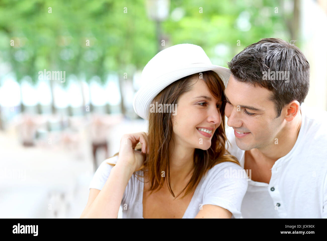 Lovers looking at each other with romantic look Stock Photo - Alamy