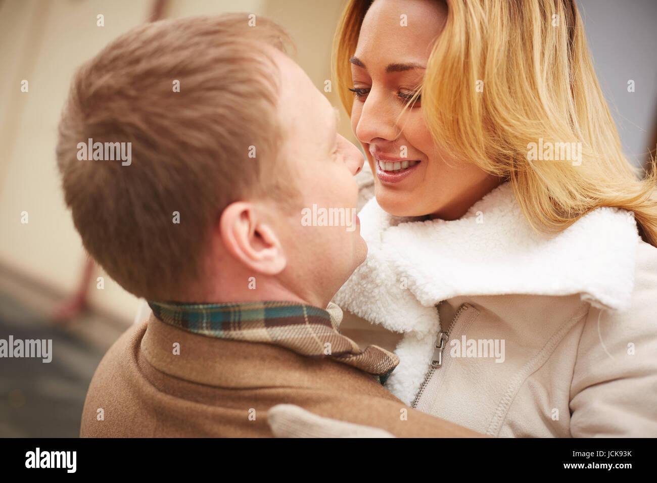 Charming girl smiling on her sweetheart Stock Photo - Alamy