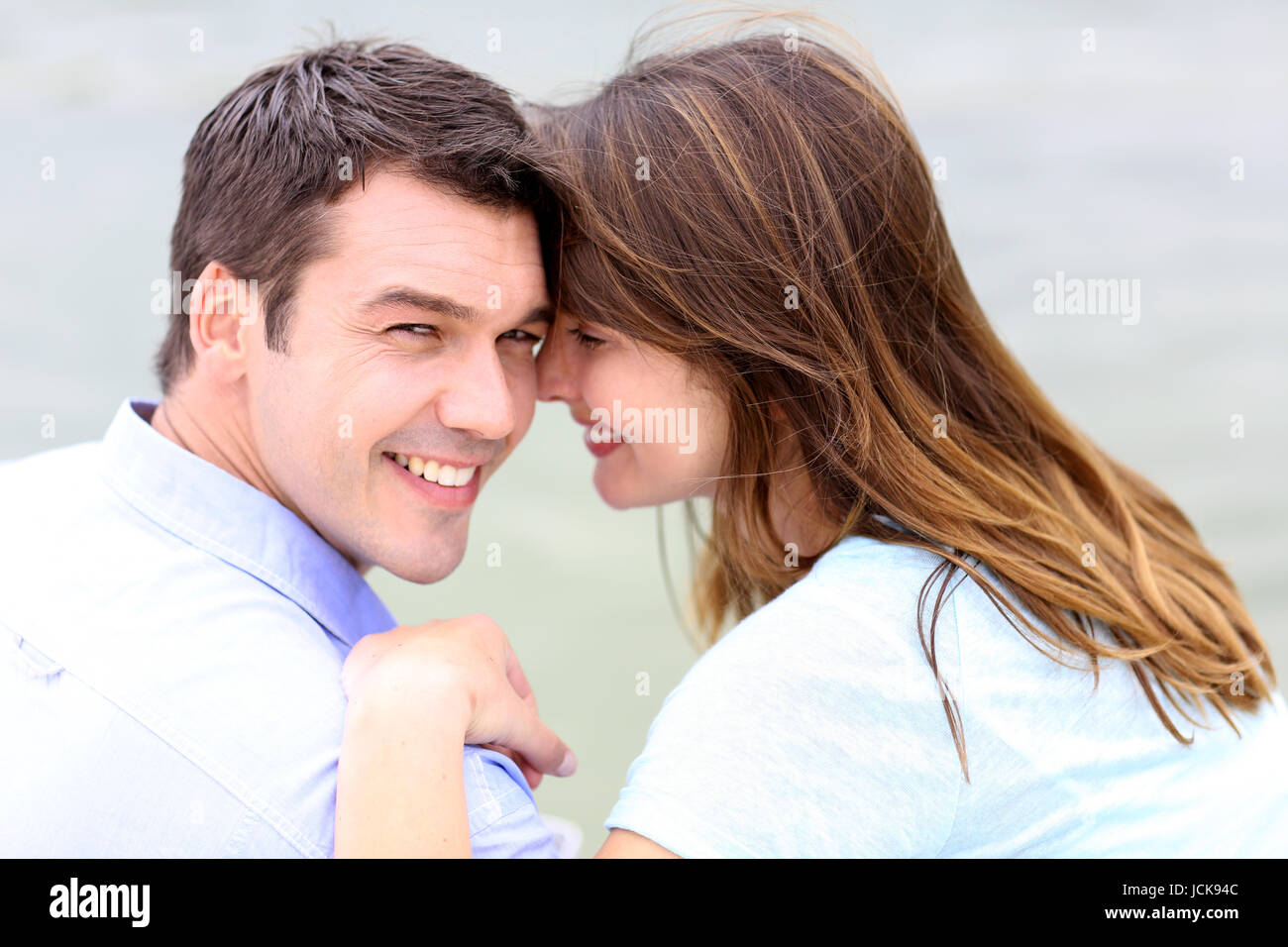 Couple of lovers in public park Stock Photo - Alamy