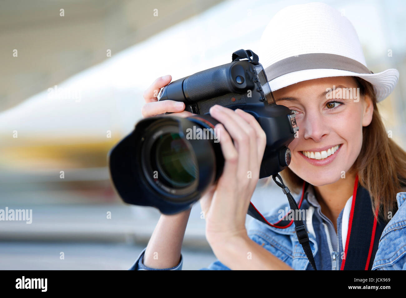 Photographer capturing photo with professional camera Stock Photo - Alamy