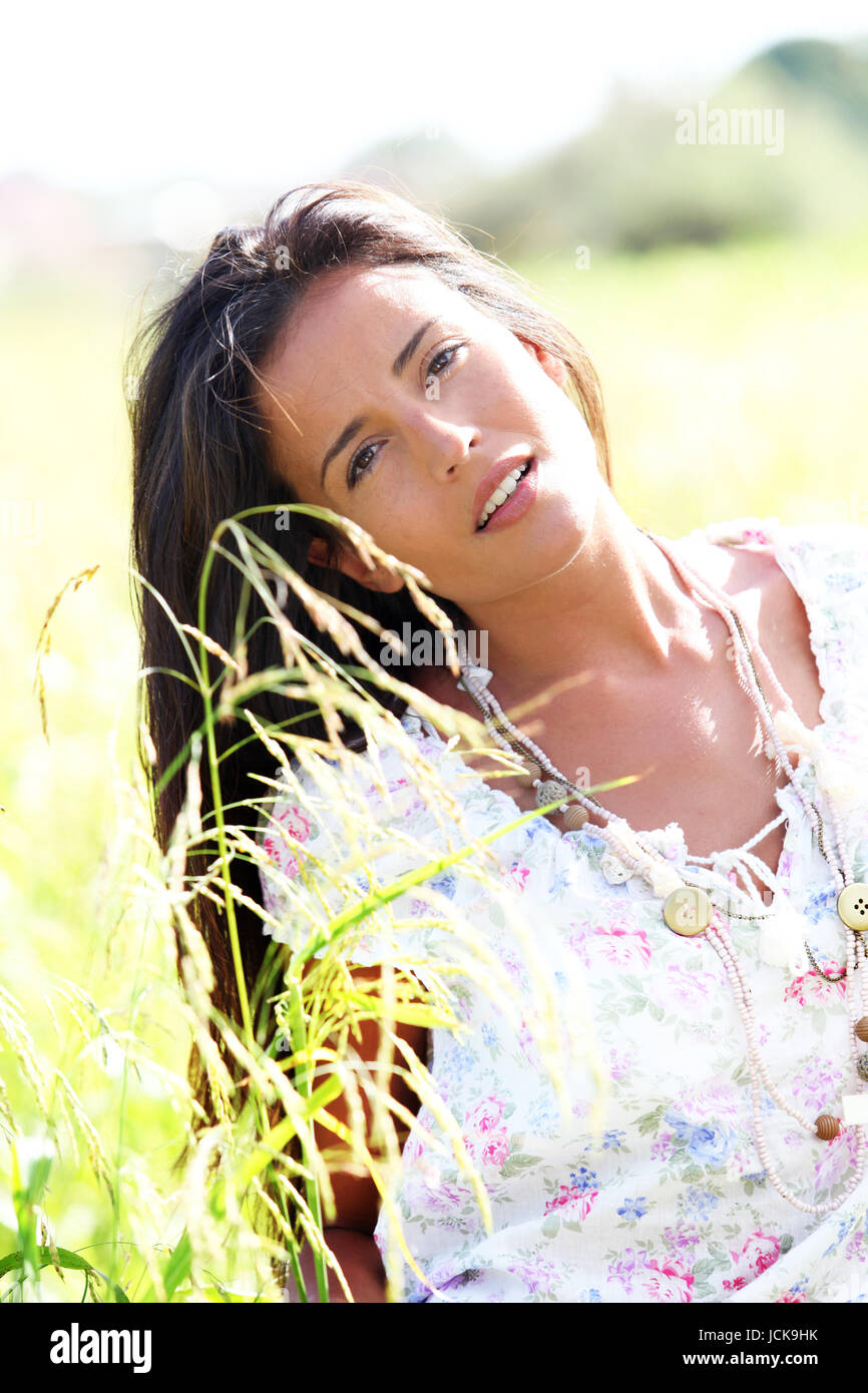 Beautiful woman in country field Stock Photo - Alamy