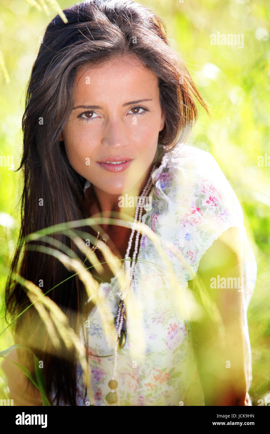 Beautiful woman in country field Stock Photo - Alamy