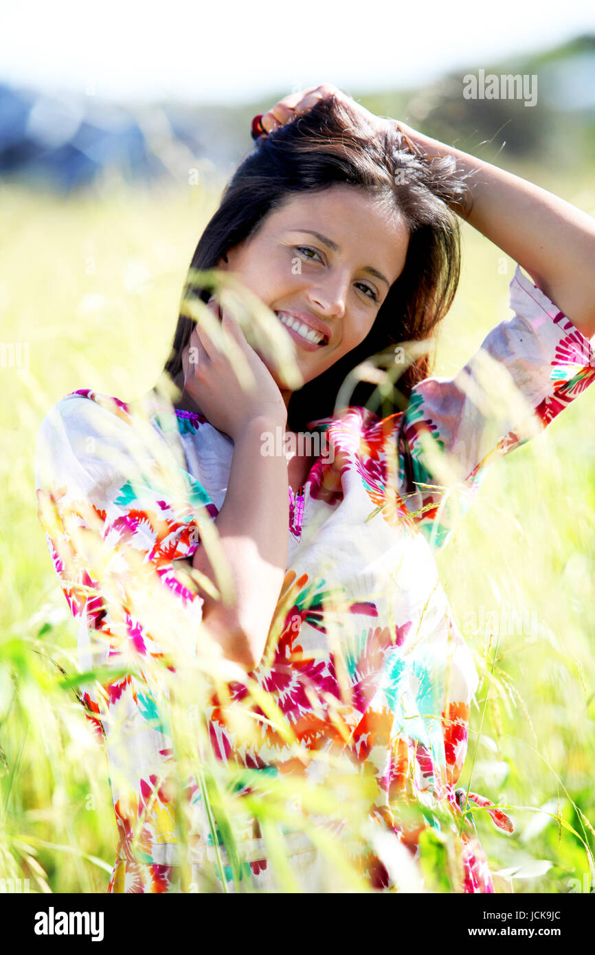 Beautiful woman in country field Stock Photo - Alamy