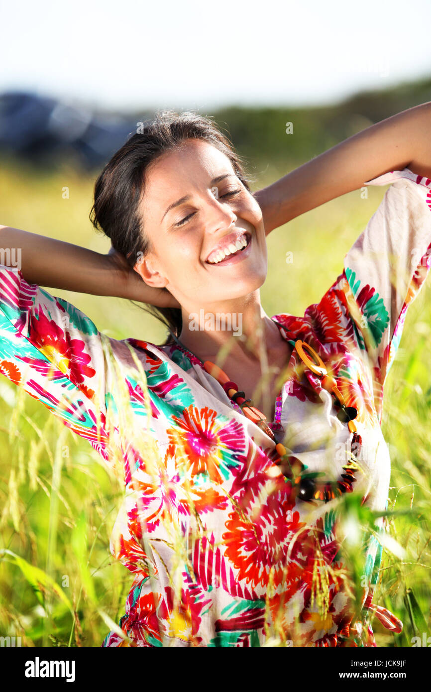 Beautiful woman in country field Stock Photo - Alamy
