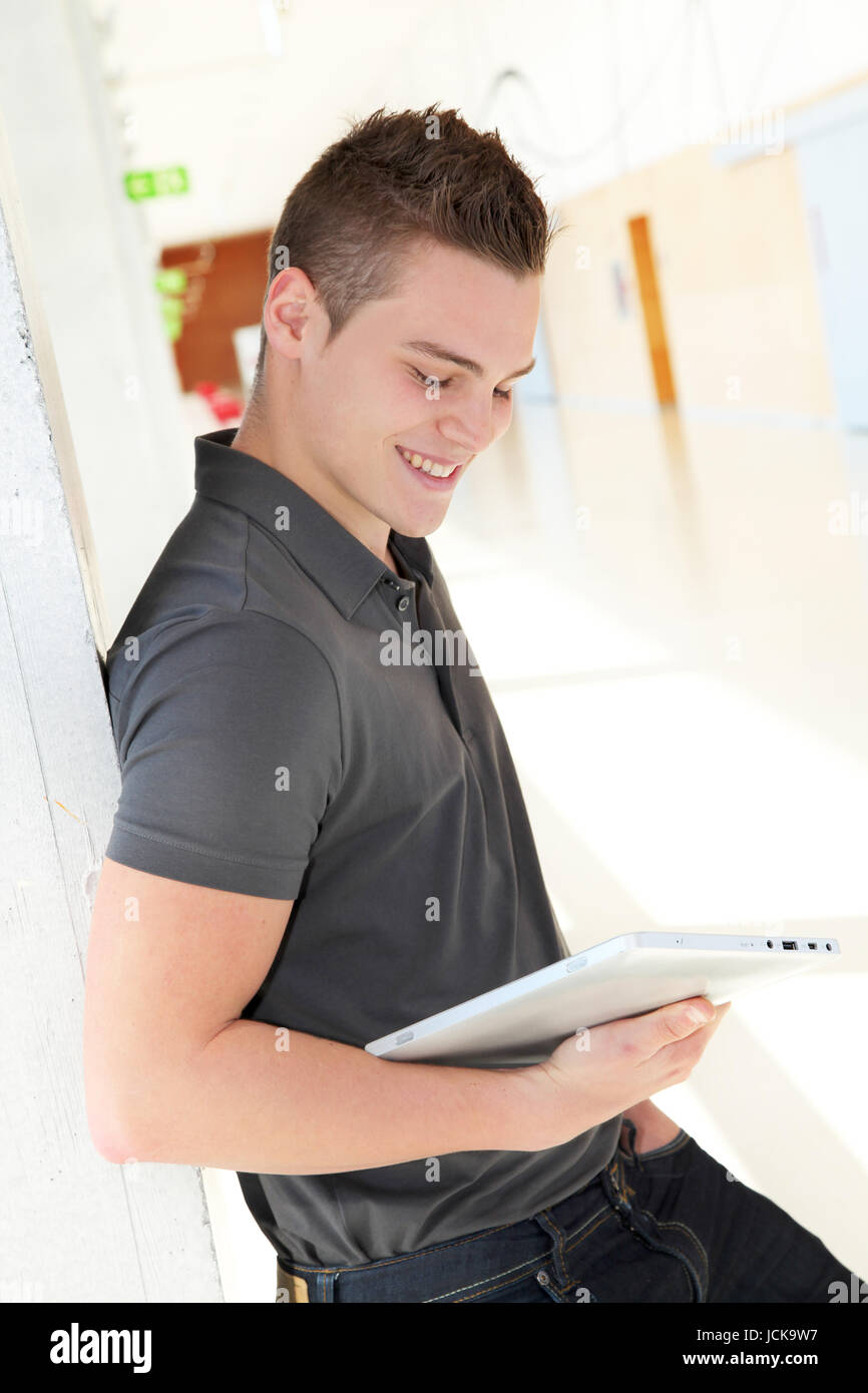 Portrait of student using electronic tablet at school Stock Photo - Alamy