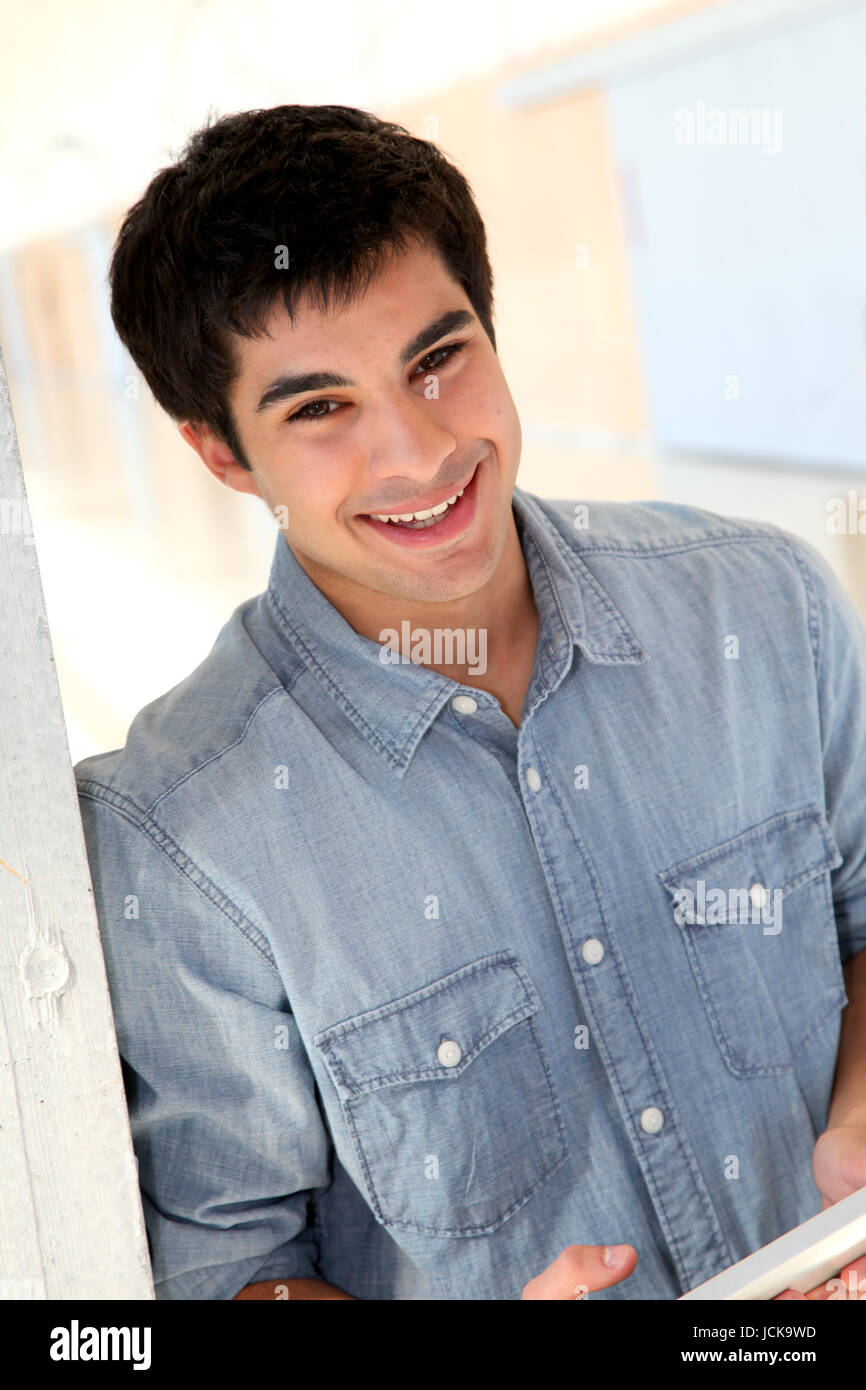 Portrait of student boy in school hallway Stock Photo - Alamy