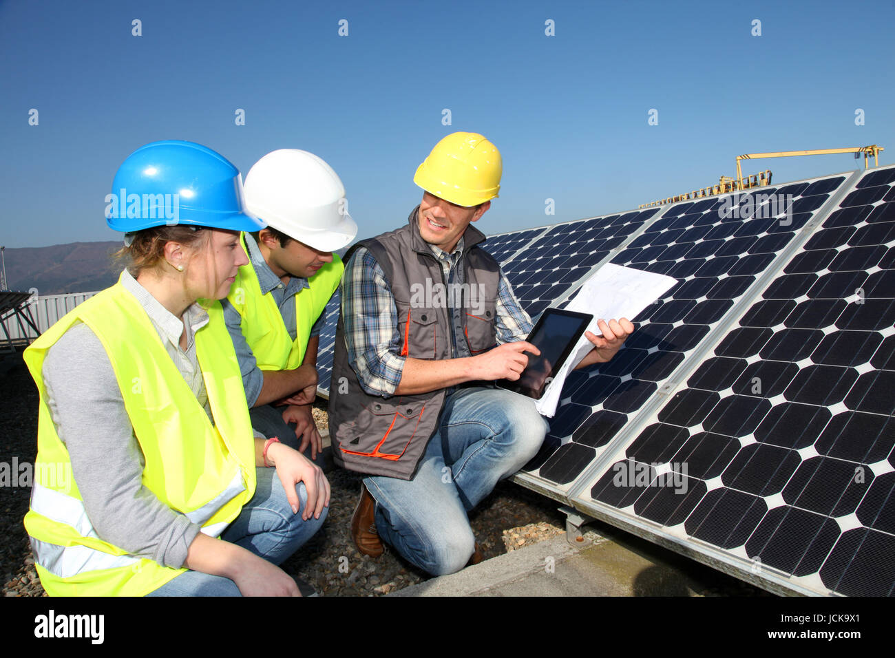 Engineering professional with group of students in training Stock Photo ...