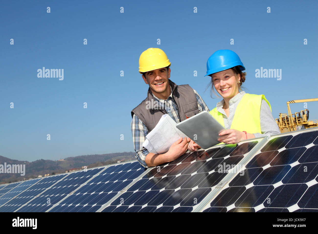 Man showing solar panels technology to student girl Stock Photo - Alamy