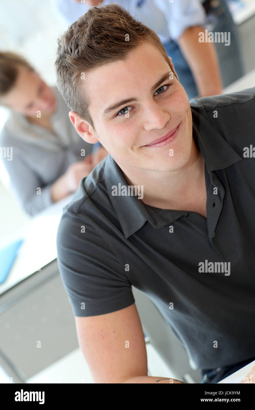 Portrait of cheerful student boy in class Stock Photo - Alamy