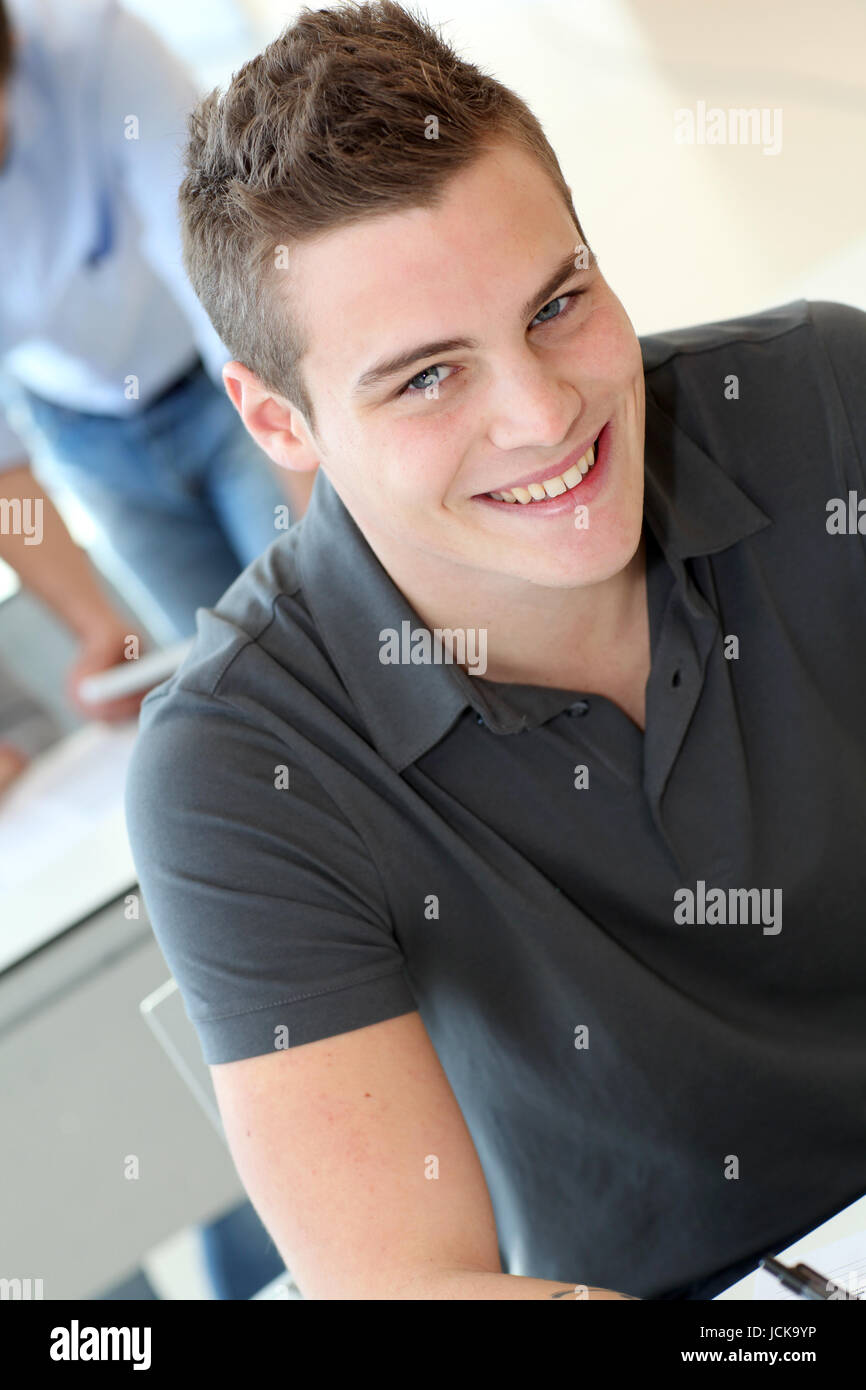 Portrait of cheerful student boy in class Stock Photo - Alamy