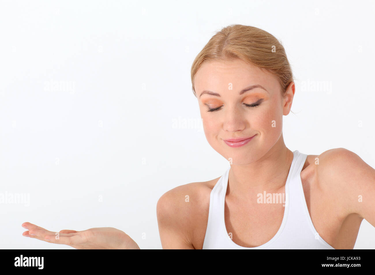 Portrait of woman on white background with eyes shut Stock Photo - Alamy
