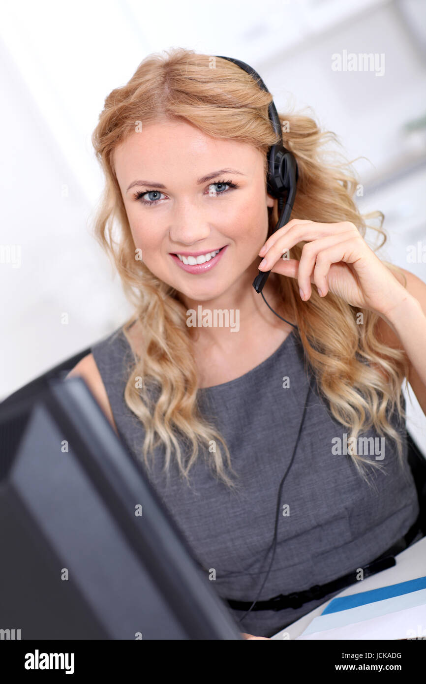 Beautiful customer-service woman with headset on Stock Photo - Alamy