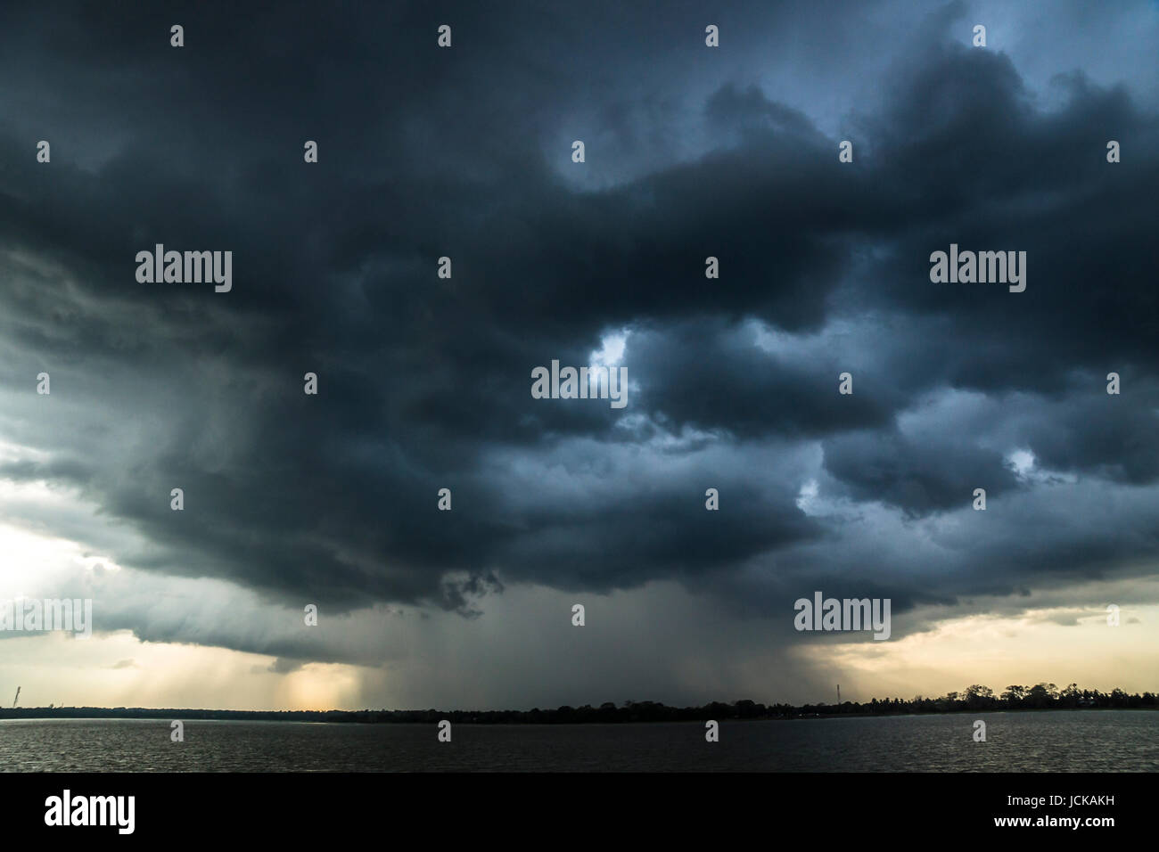 Storm arriving over a lake Stock Photo - Alamy